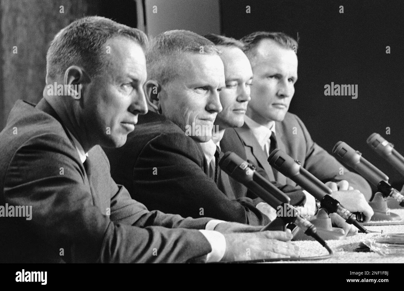 The primary crew and the back up crew for Gemini 7 as they answer questions about their fourteen ...