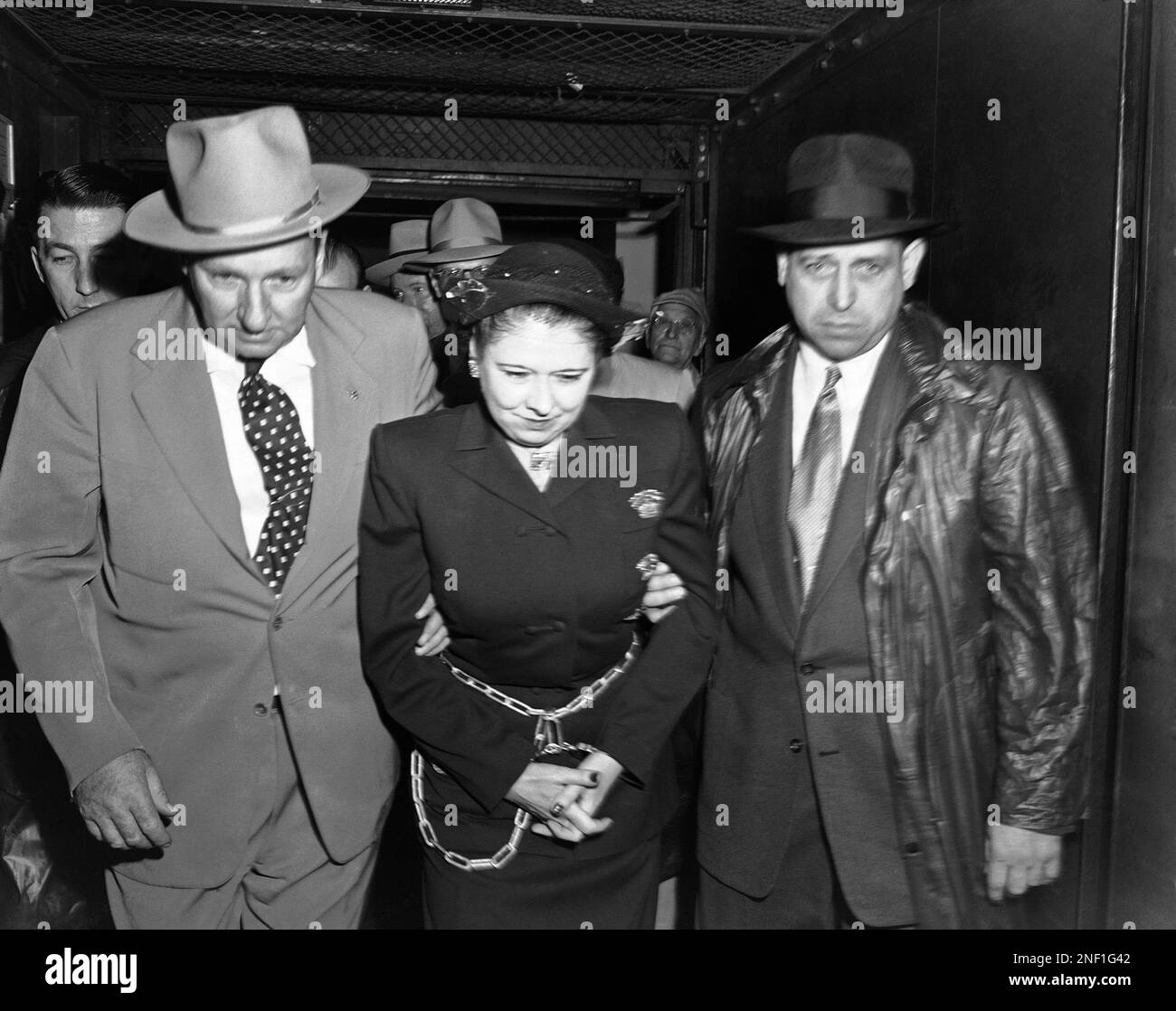 Handcuffed and chained Mrs. Bonnie Brown Heady is led out of the U.S ...