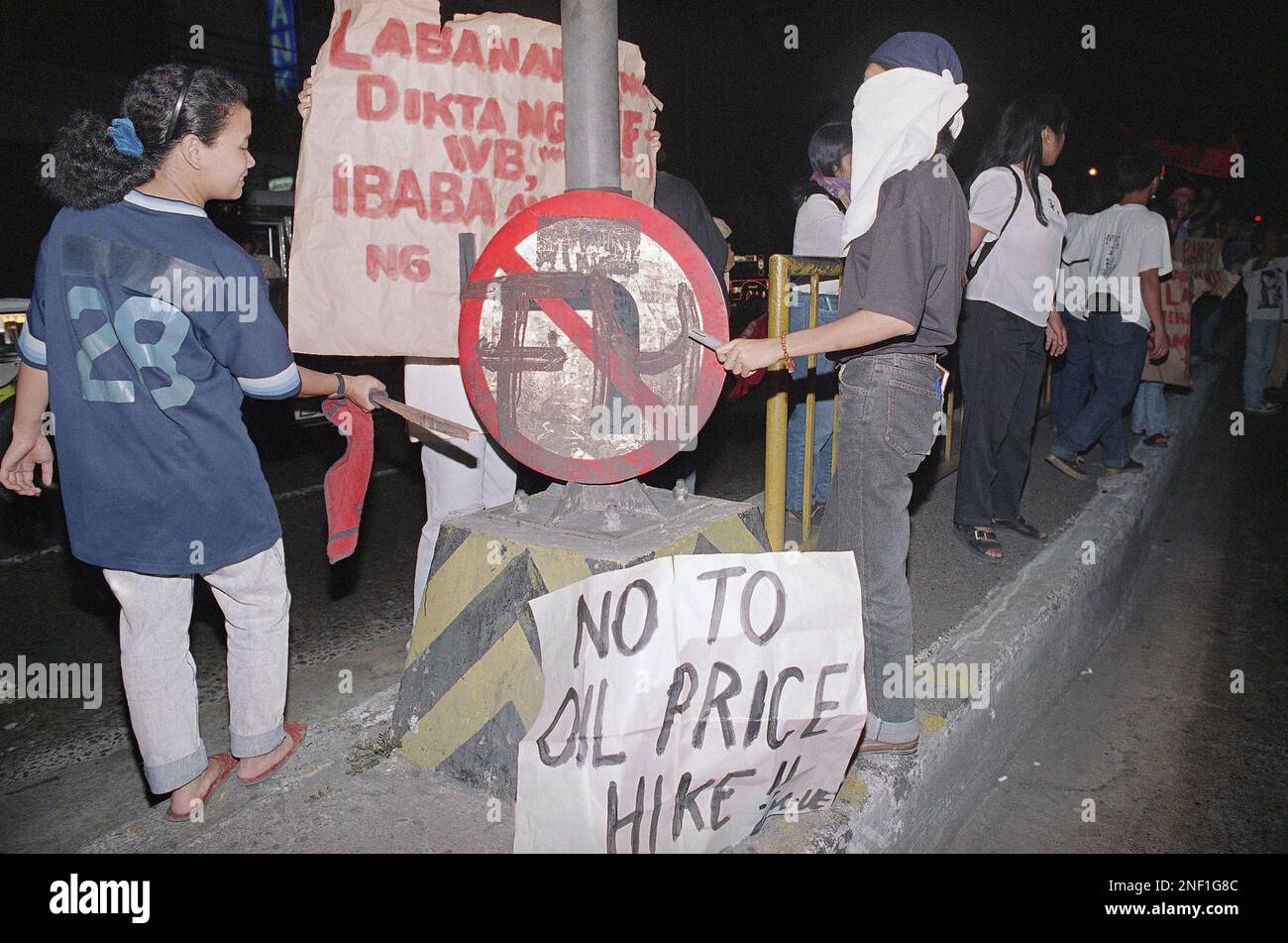 Leftist students bang traffic signs and railings, Friday, Feb. 4, 1994 ...