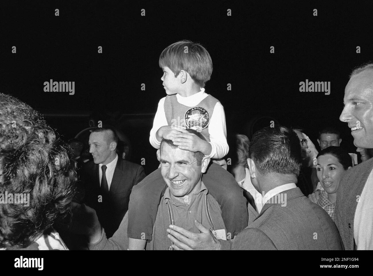 Apollo 13 Astronaut James Lovell Jr., holds his son, Jeff Lovell, 4, as ...