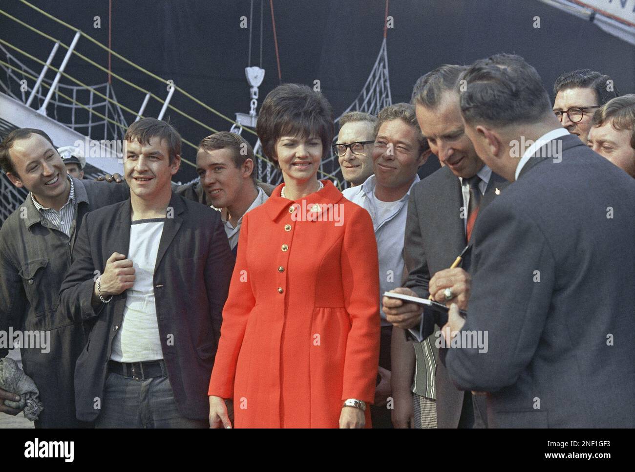 Astronaut Capt. James Lovell and his wife Marilyn surrounded by docks ...