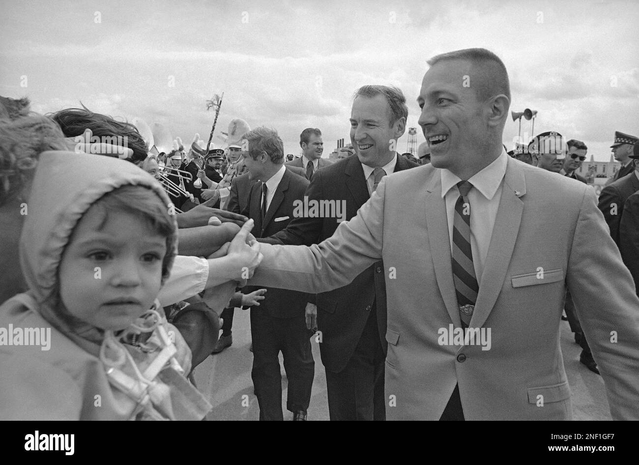 Astronaut James A. Lovell Jr., and John L. Swigert Jr., right, shake ...