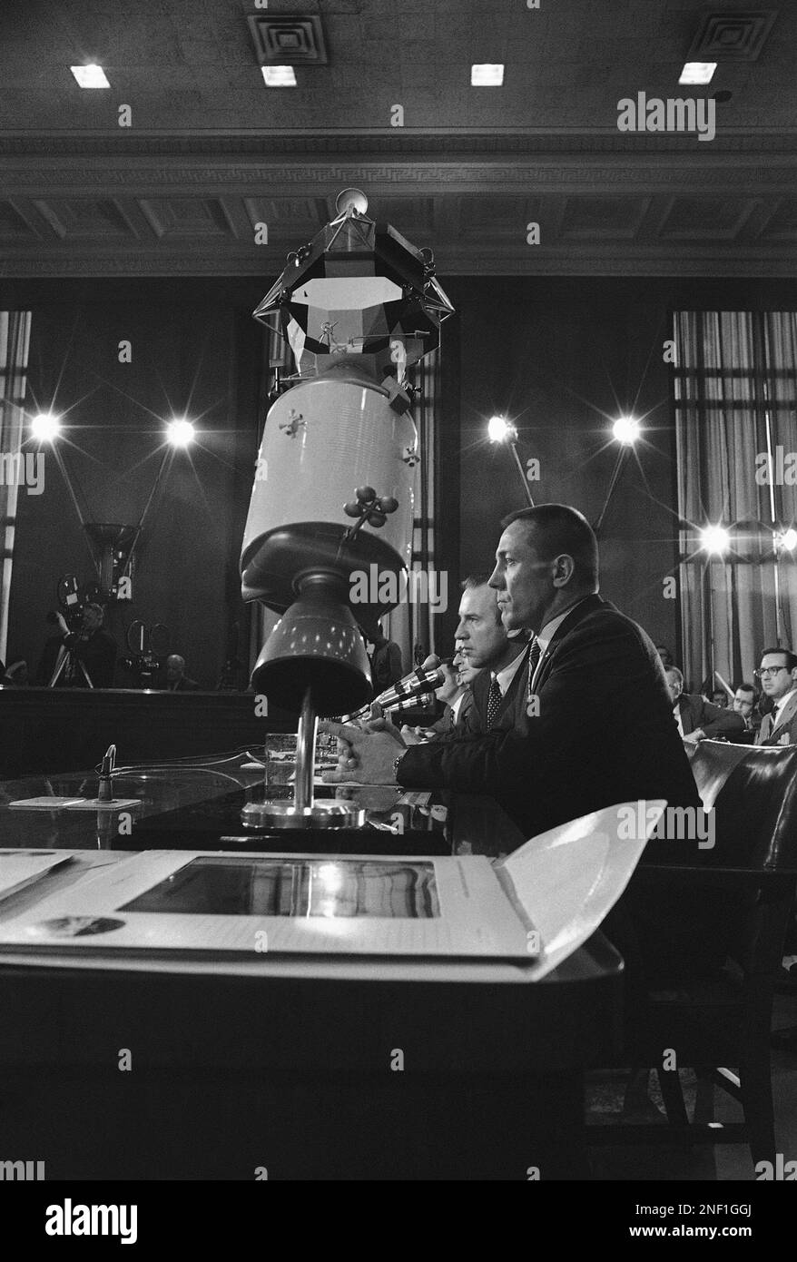 Astronaut James A. Lovell Jr. and John L. Swigert Jr., front, share the spotlight in the Senate ...