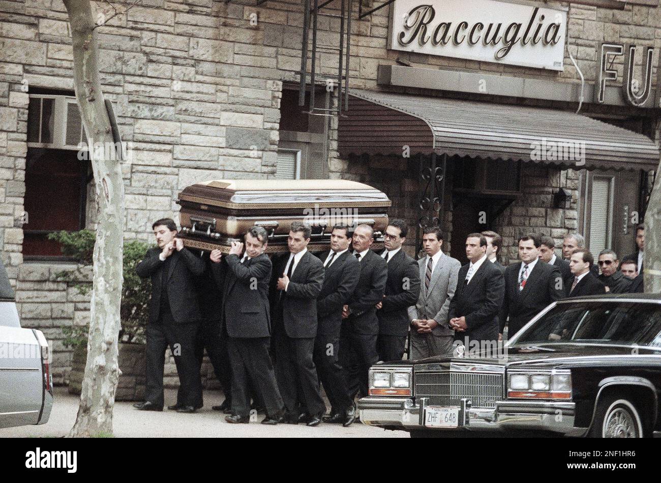 Pall bearers carry the bronze casket of Bartholomew “Bobby” Boriello ...