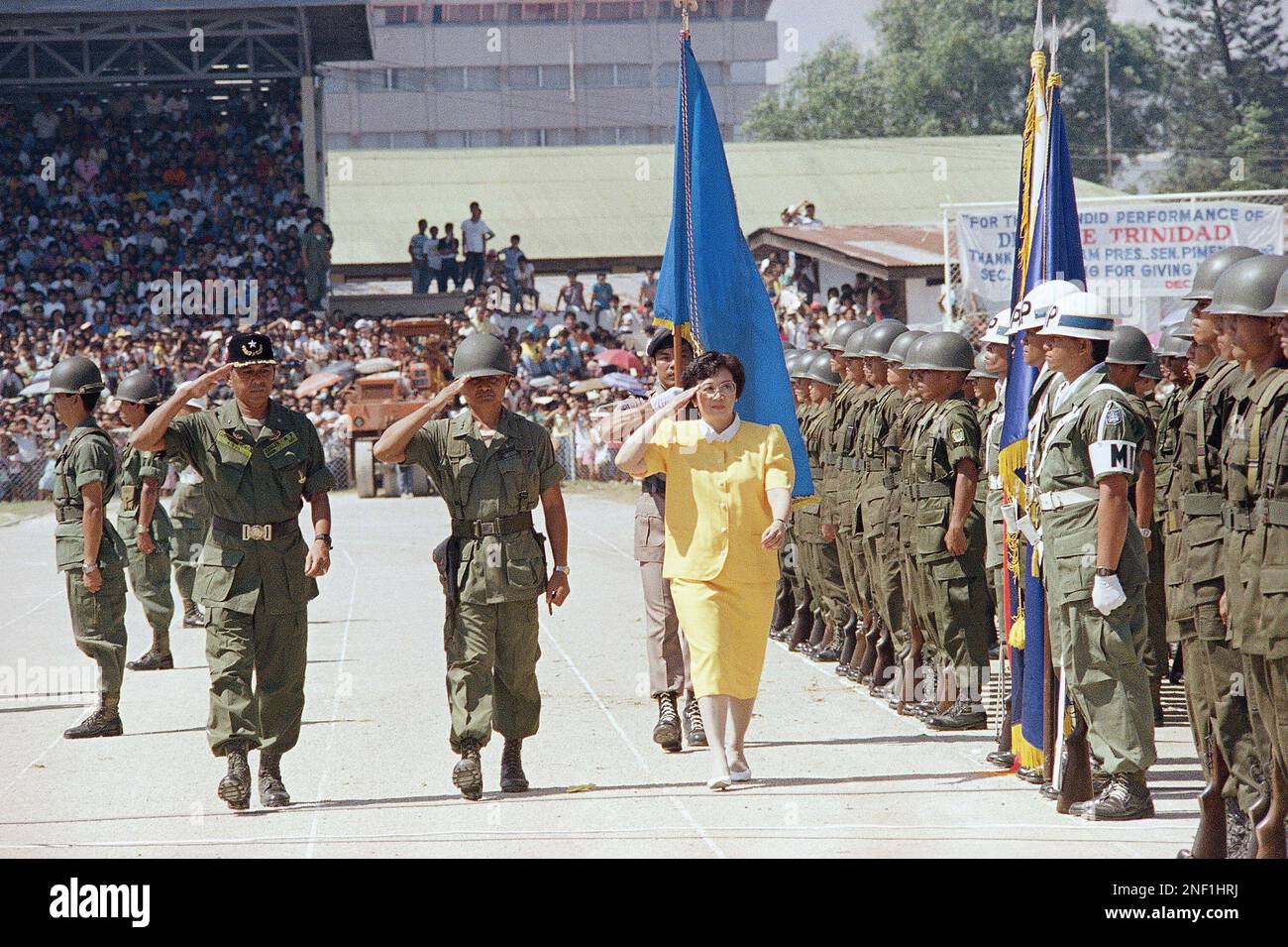 President Corazon Aquino, center, accompanied by Brig. Gen. Mariano ...