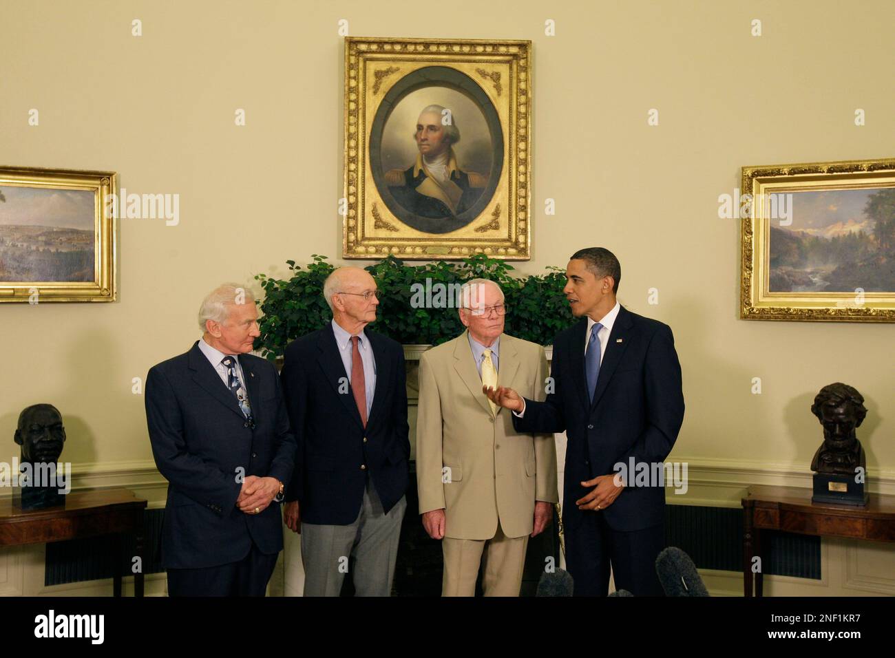 President Barack Obama, right, greets Buzz Aldrin, left, Michael ...