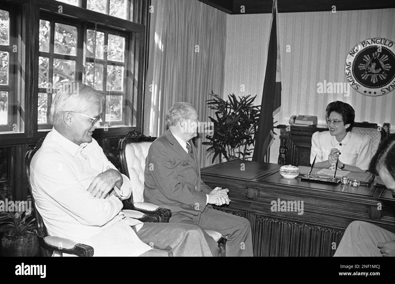 Philippine President Corazon Aquino, right, chats with Gaston Sigur ...