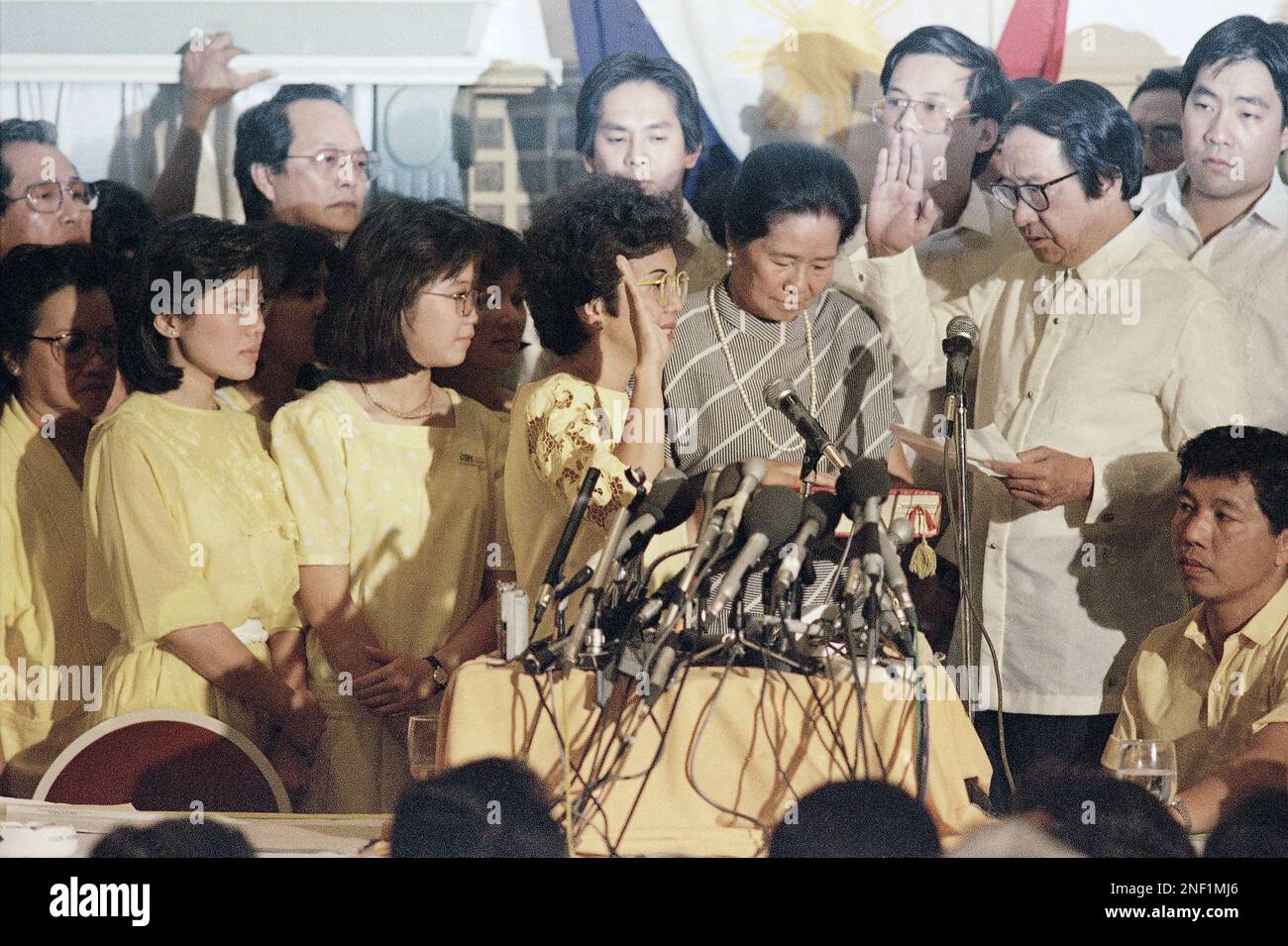 Corazon Aquino is taking the oath as the new president of the ...