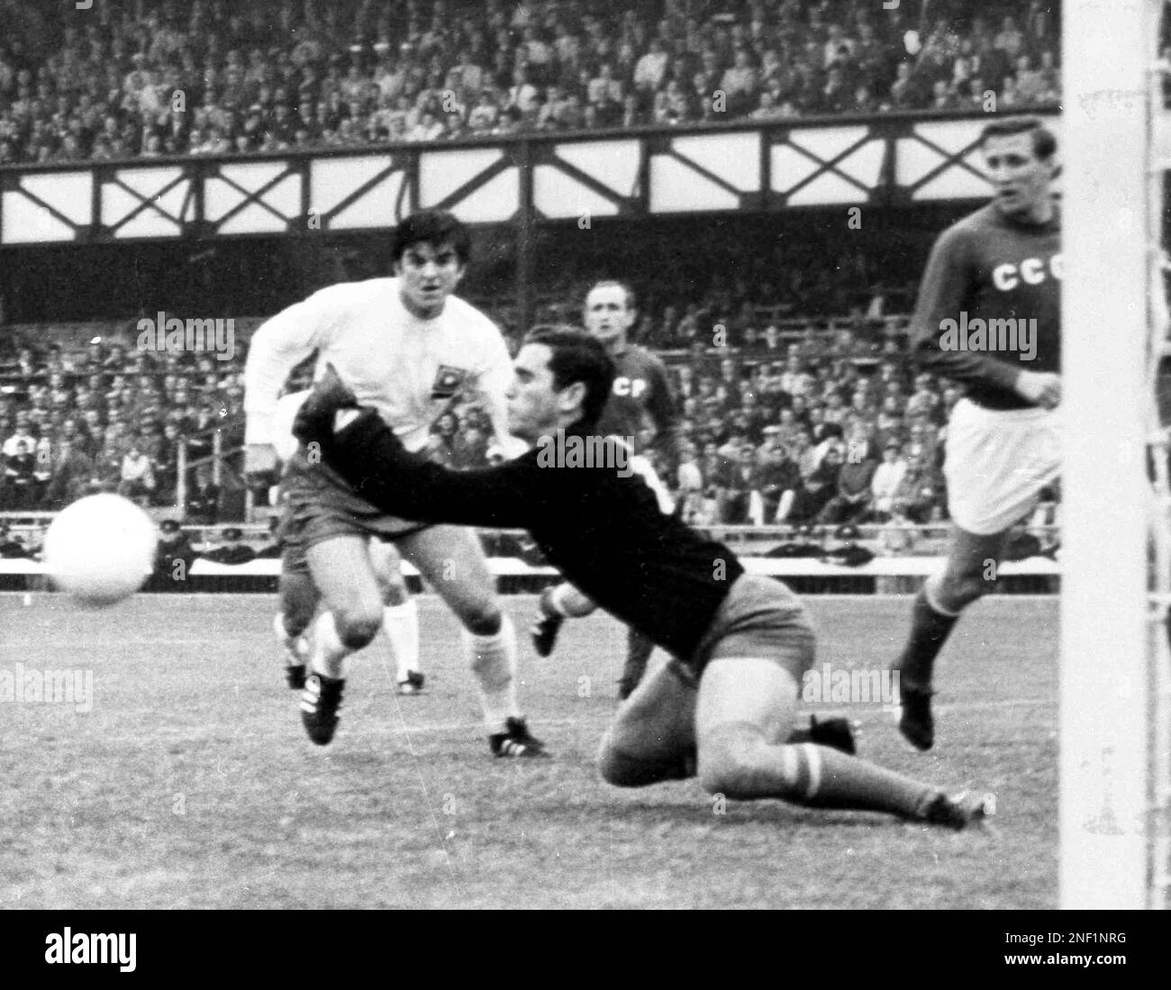 Russian goalkeeper Lev Yashin punches the ball away from Chile's Ruben ...