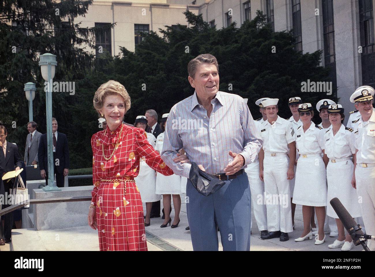 President Ronald Reagan, holding a Navy cap, thanks the medical team of ...