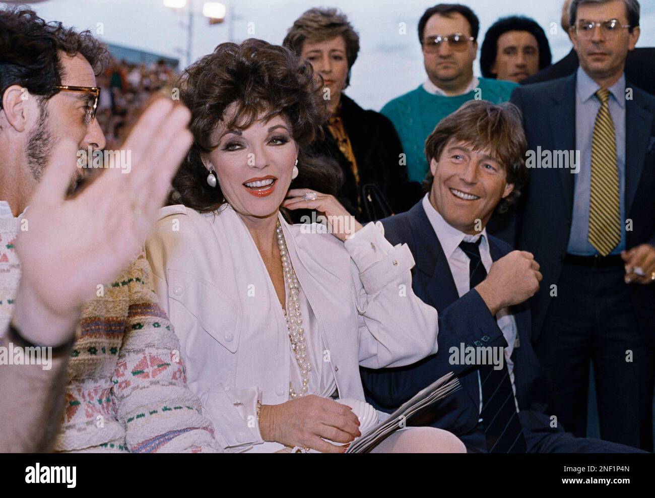 Actress Joan Collins with Bill Wiggins at Hagler-Leonard fight on April ...