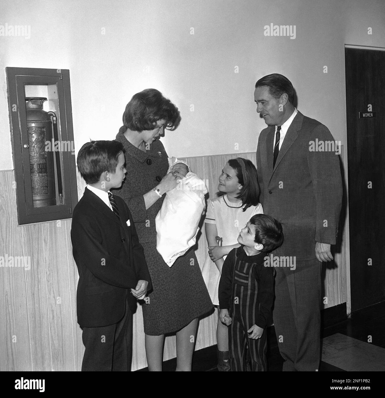 Mother holds the newest member as the Sargent Shriver family gets ...