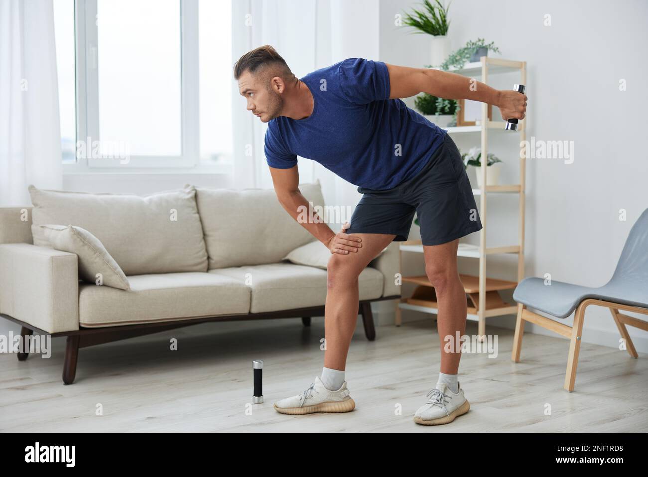 Man athlete pain and injury back arm and leg at home, sports injury ...