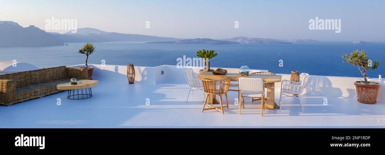 outside terrace of a restaurant by the ocean of Santorini Greece ...