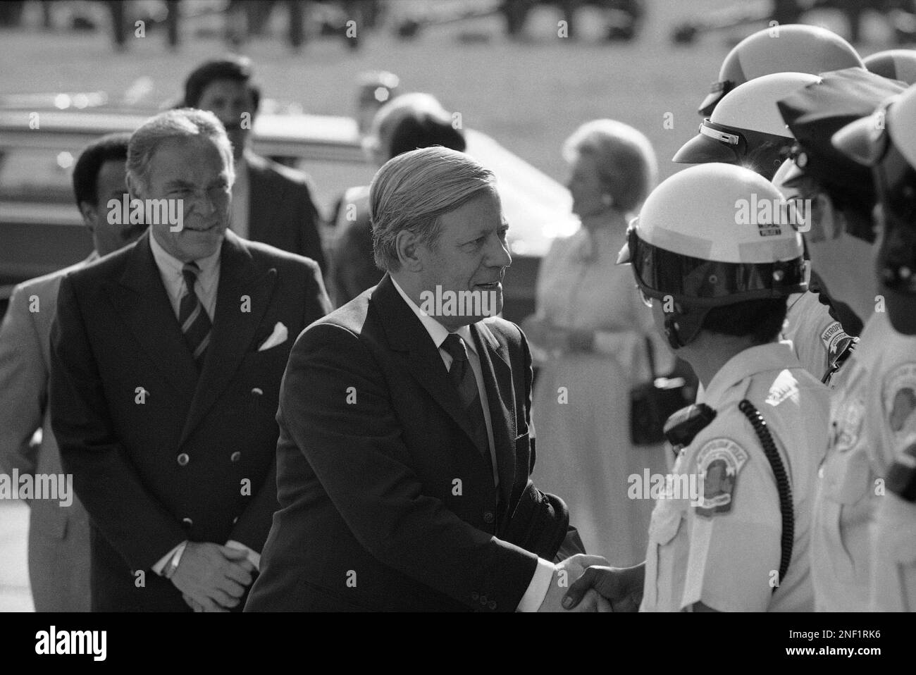 West German Chancellor Helmut Schmidt greets the police detail that ...