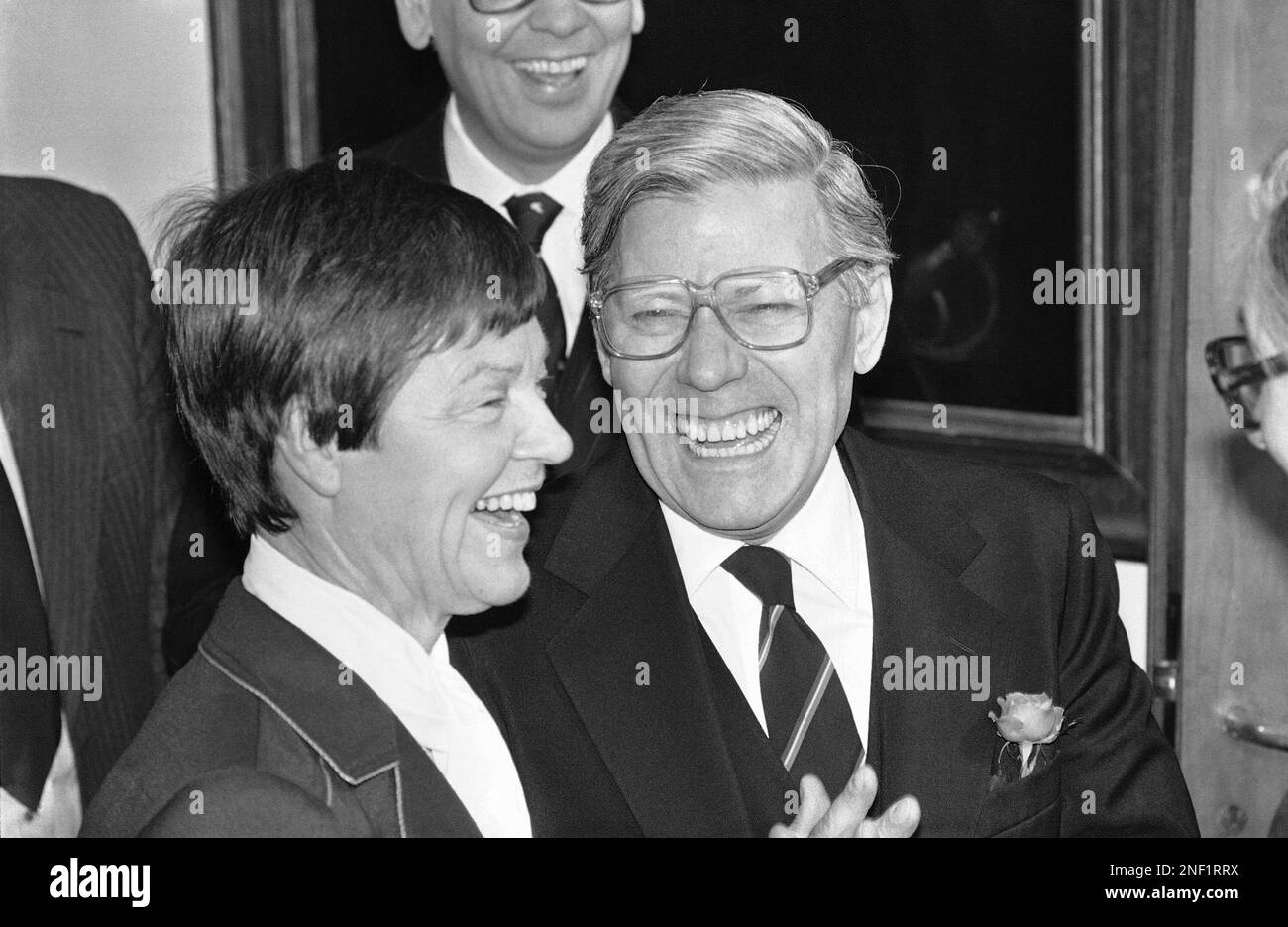 Laughing West German Chancellor Helmut Schmidt, right, and his wife ...