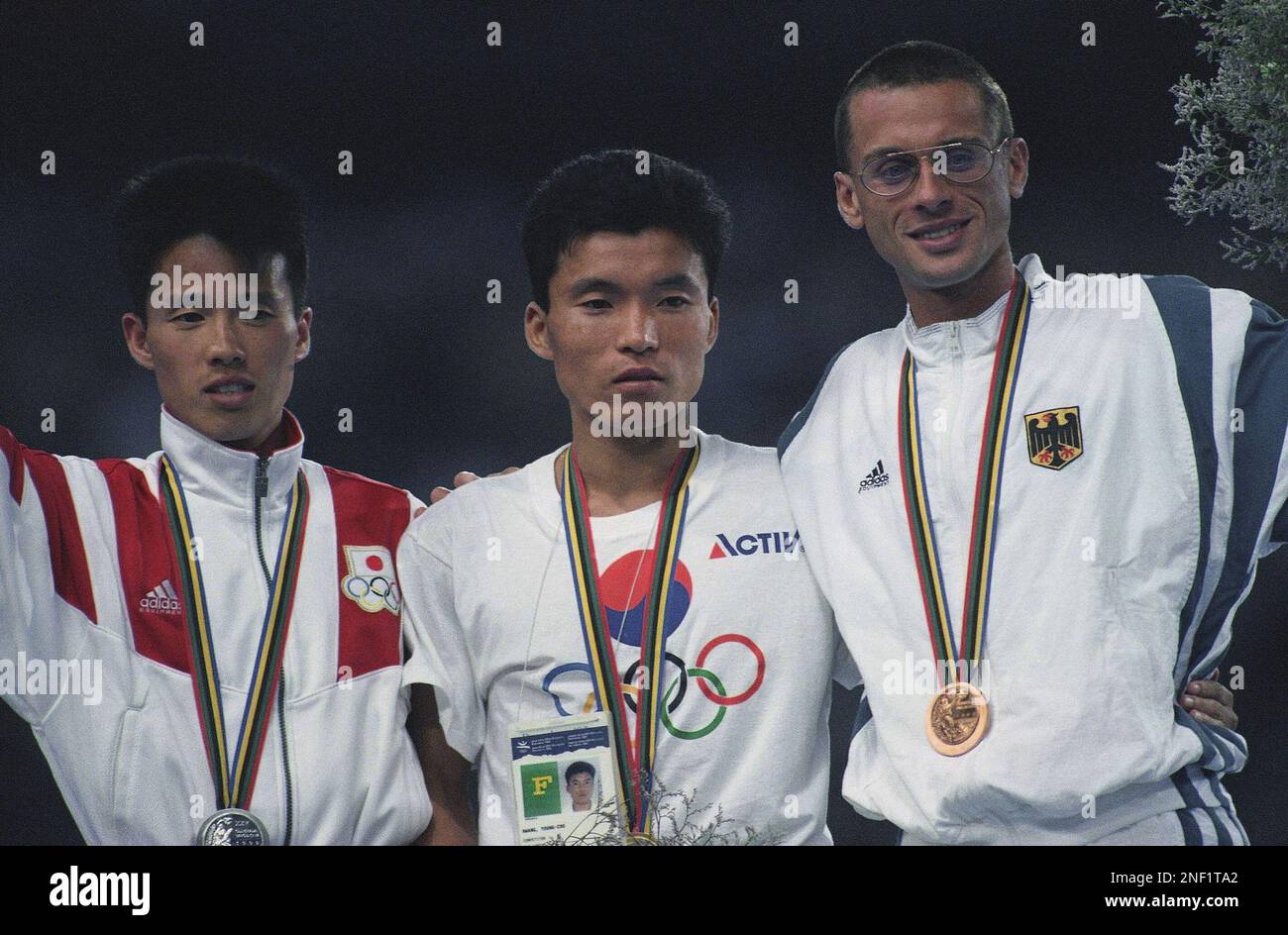 The winners of the men’s marathon wear their medals during the award ...
