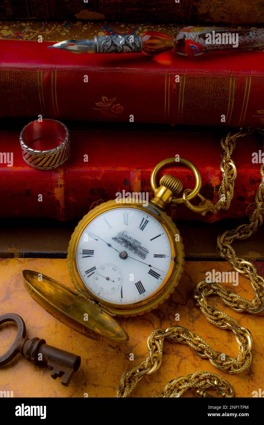 Train Pocket Watch And Old Books Stock Photo - Alamy