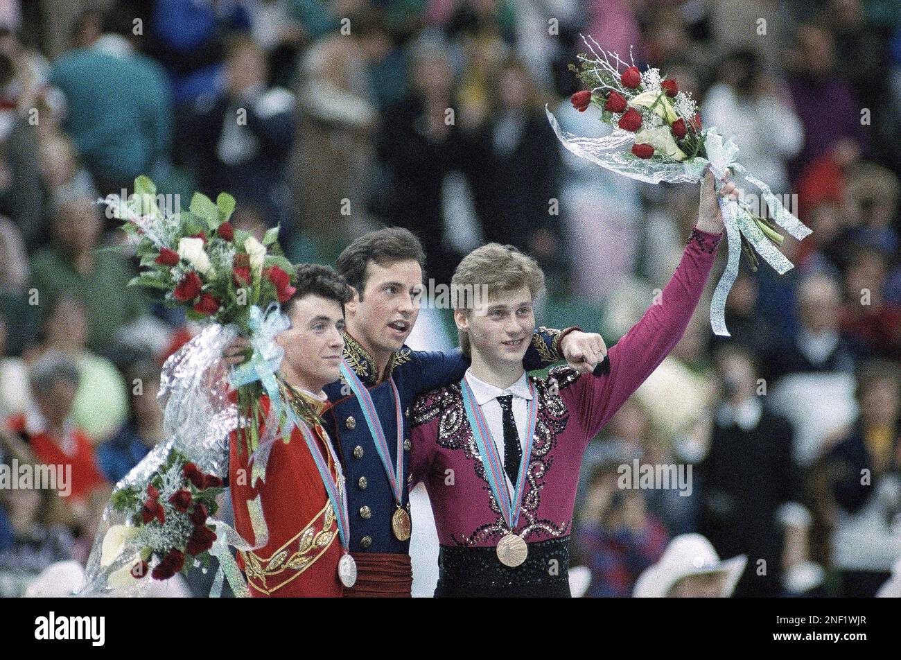 U.S. figure skater Brian Boitano, center, who won the gold medal is ...