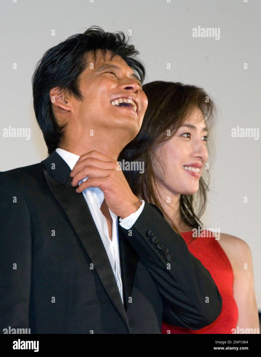 Japanese actor Yuji Oda, left, and actress Yuki Amami reacts during the ...