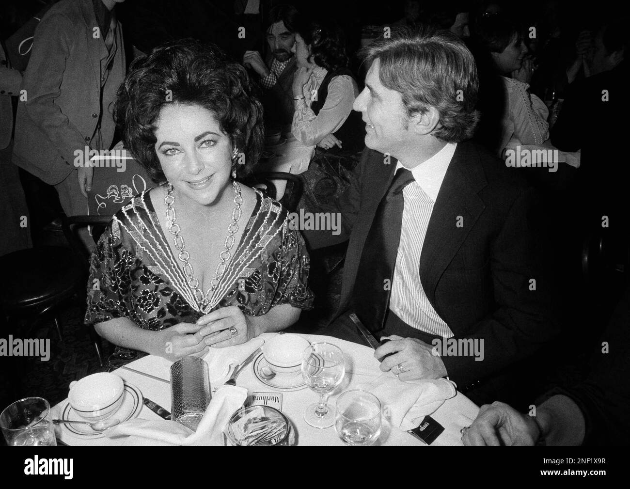 Elizabeth Taylor with husband John Warner at Sardi’s in New York City ...