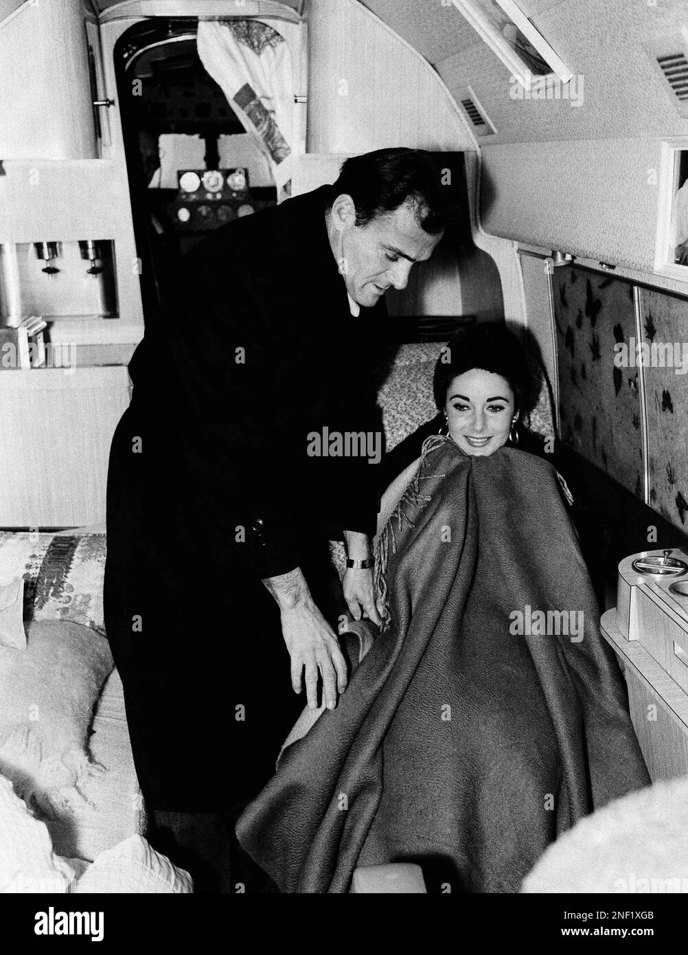 Film producer Mike Todd makes sure his wife, actress Elizabeth Taylor ...