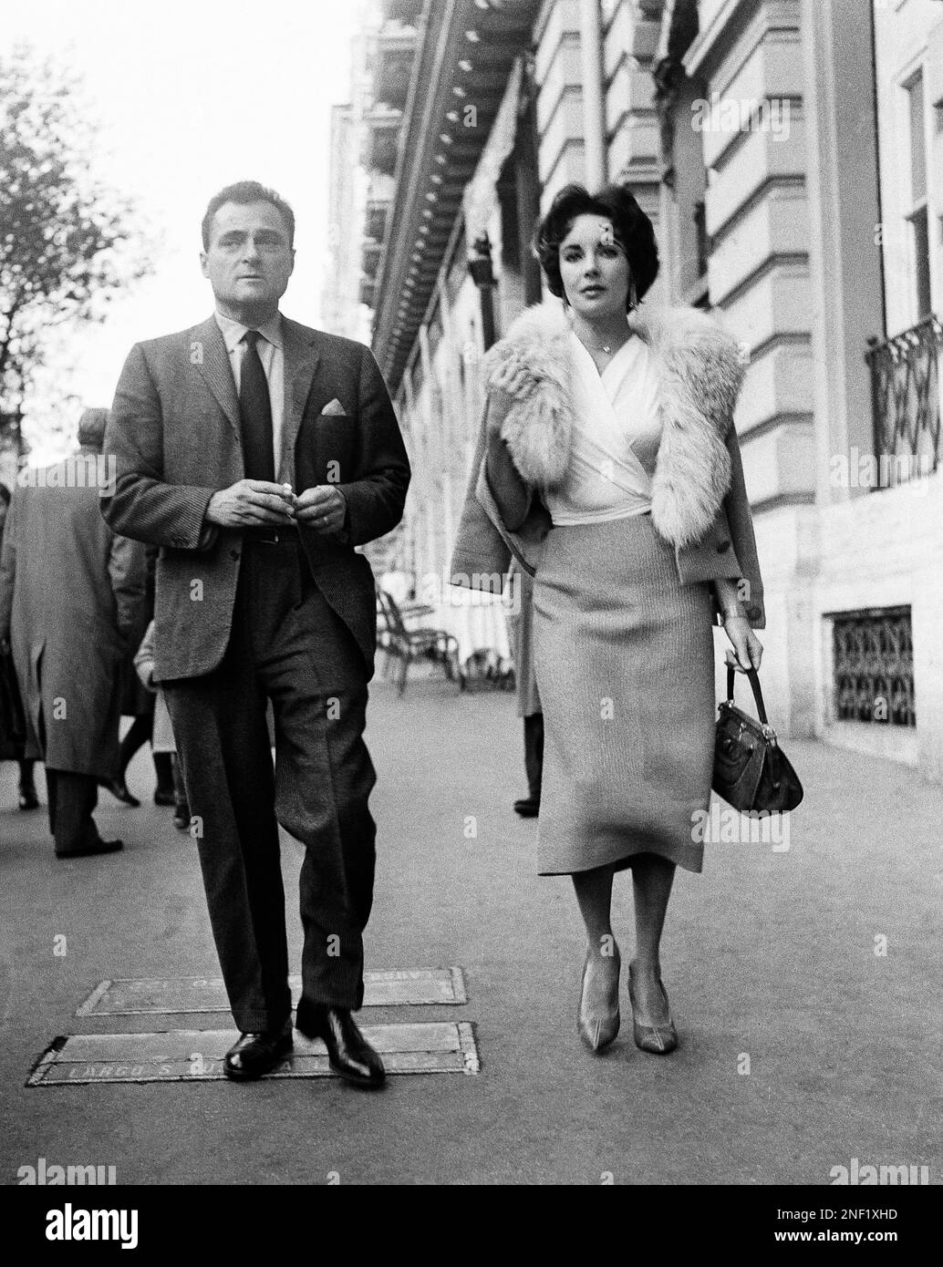 Hollywood producer Mike Todd and his wife, Elizabeth Taylor walk down ...