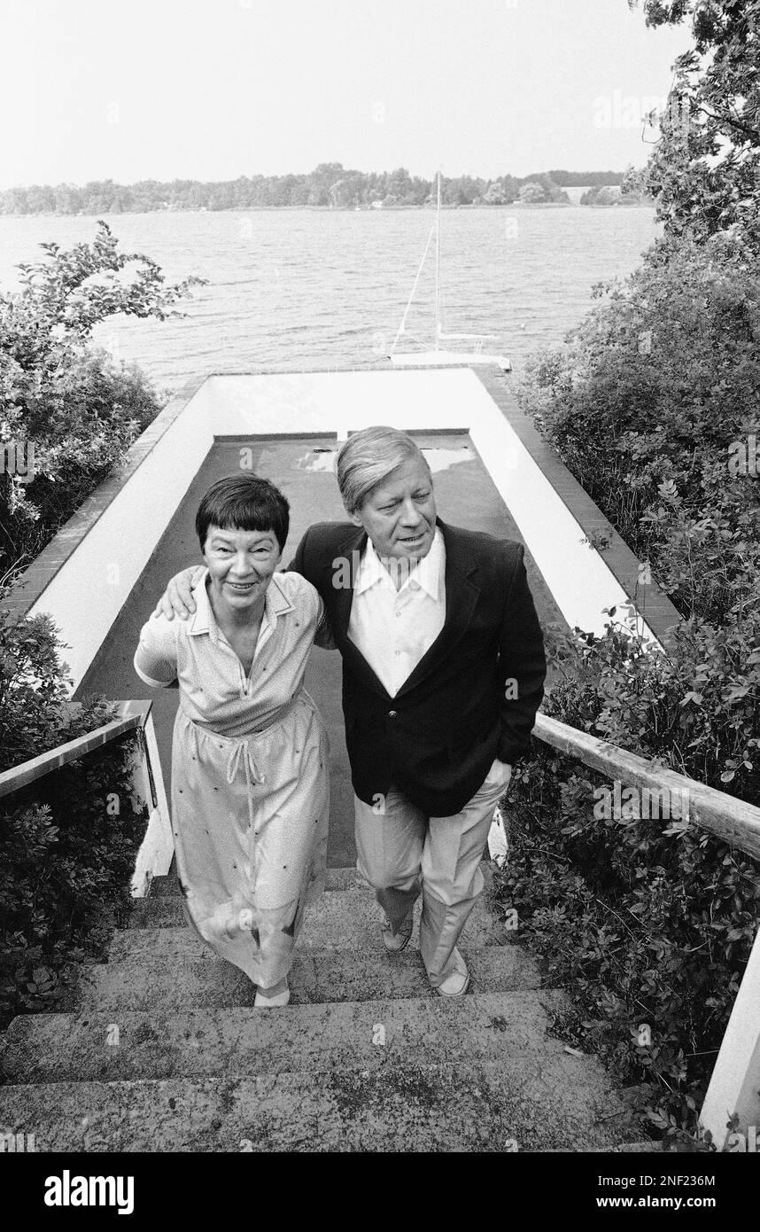 West German Chancellor Helmut Schmidt and his wife Hannelore walk ...