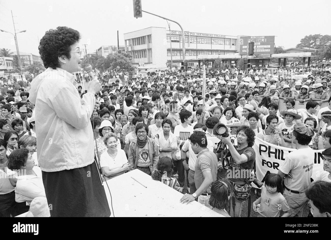 Corazon Aquino, widow of assassinated former Sen. Bengino Aquino, left, addresses a crowd during ...