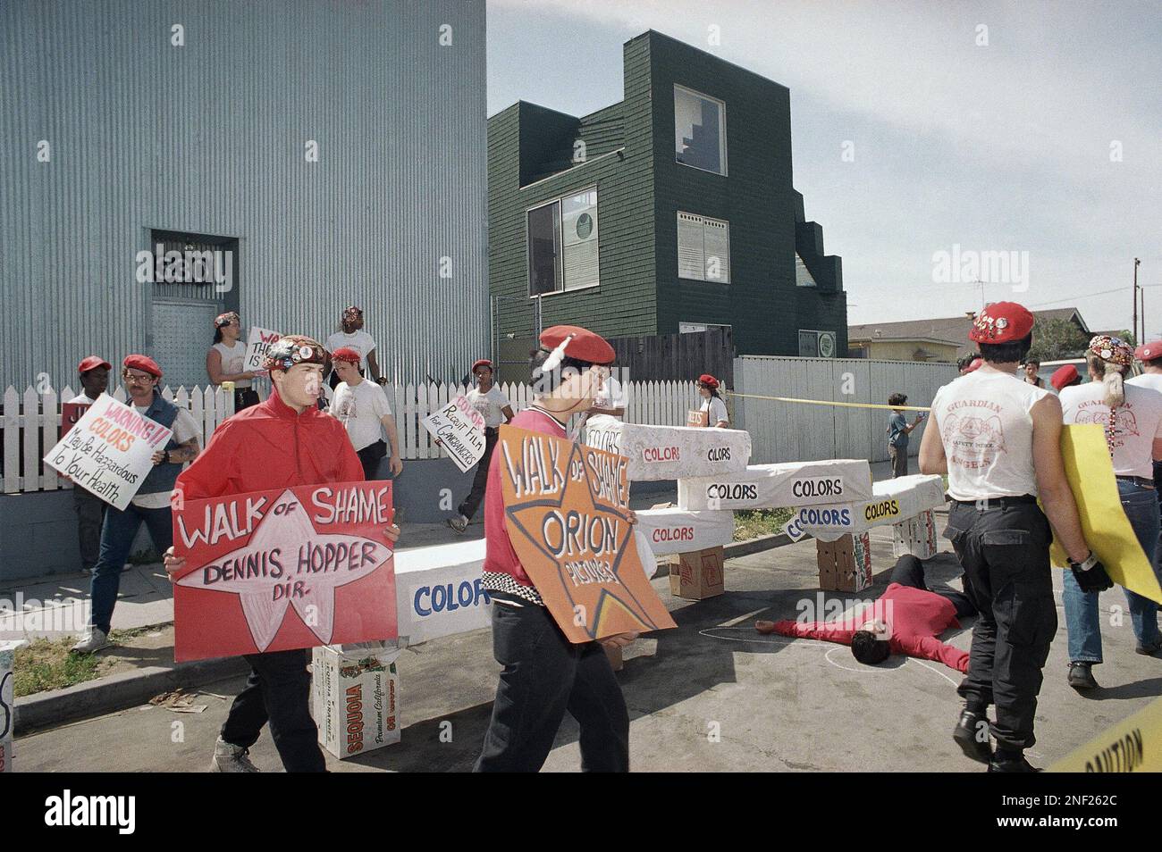 Members of the Guardian Angels protest in front of director Dennis ...