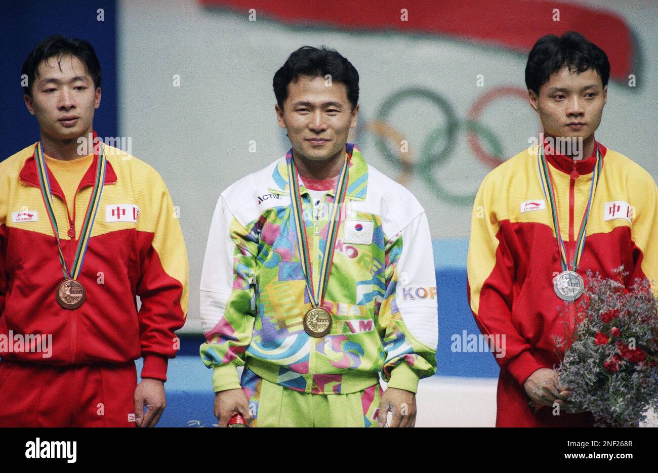 South Korean weightlifter Chun Byung-Kwan, 22, center, is seen on ...
