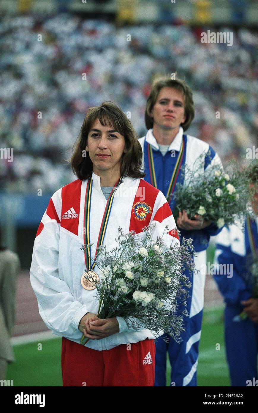 Bronze medalist Canada’s Angela Chalmers and gold medalist Elena ...