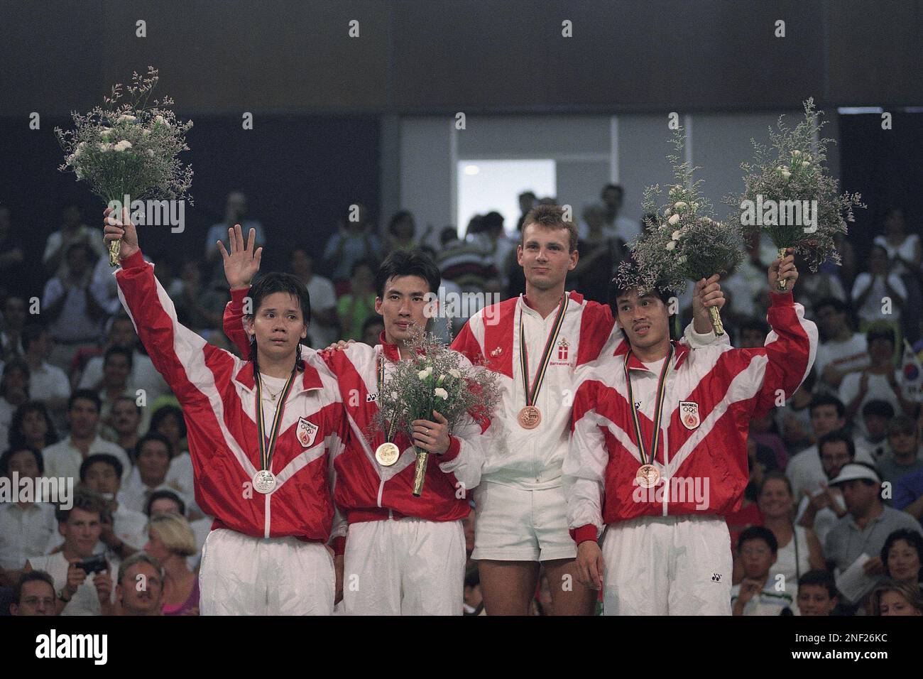Badminton medal winners wave to the crowd in Barcelona on Tuesday ...