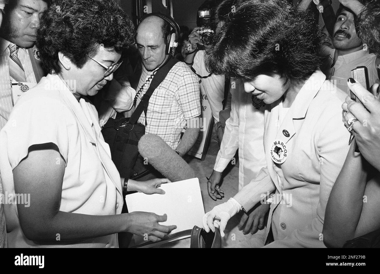 Opposition presidential candidate Corazon “Cory” Aquino, left, has her ...