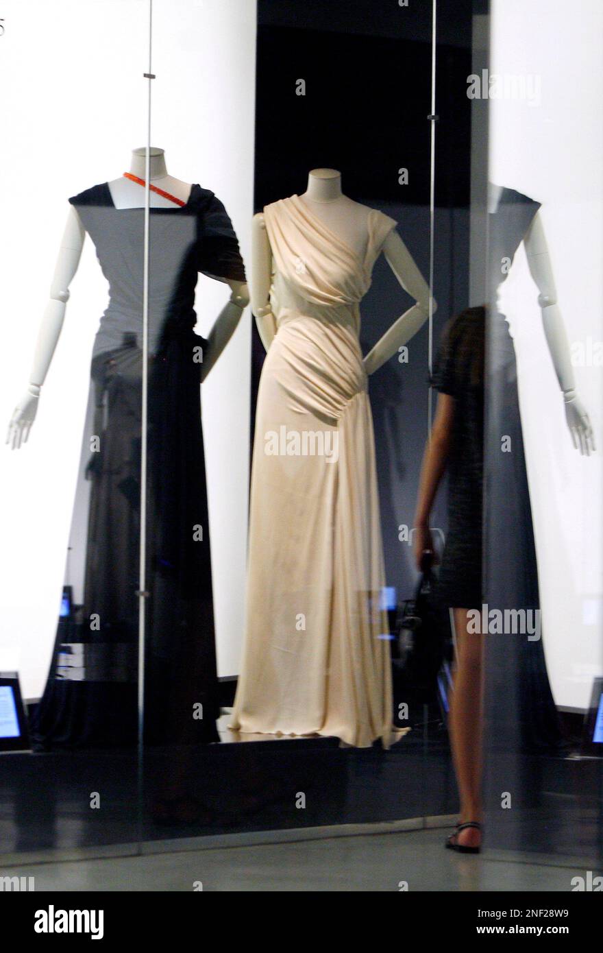 A Visitor is seen at the exhibition of late French fashion designer ...
