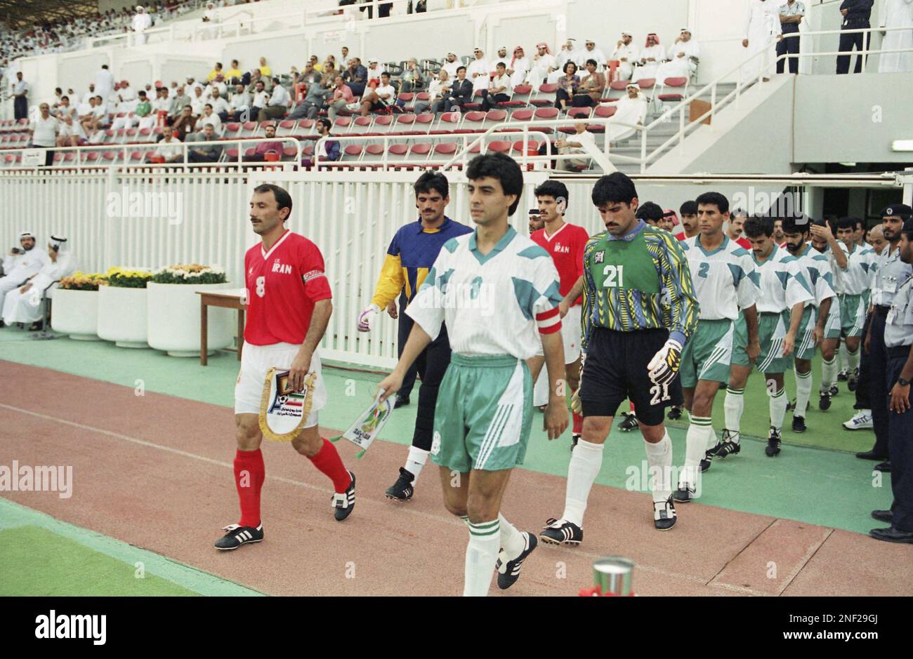 Iranian captain Derakhshan Hamid, left, and Iraqi captain Radhi Amish ...
