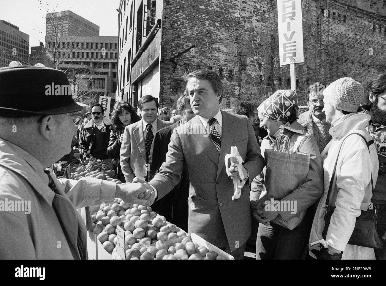 Sen. Henry Jackson of Washington, top, explains the quality of an apple ...