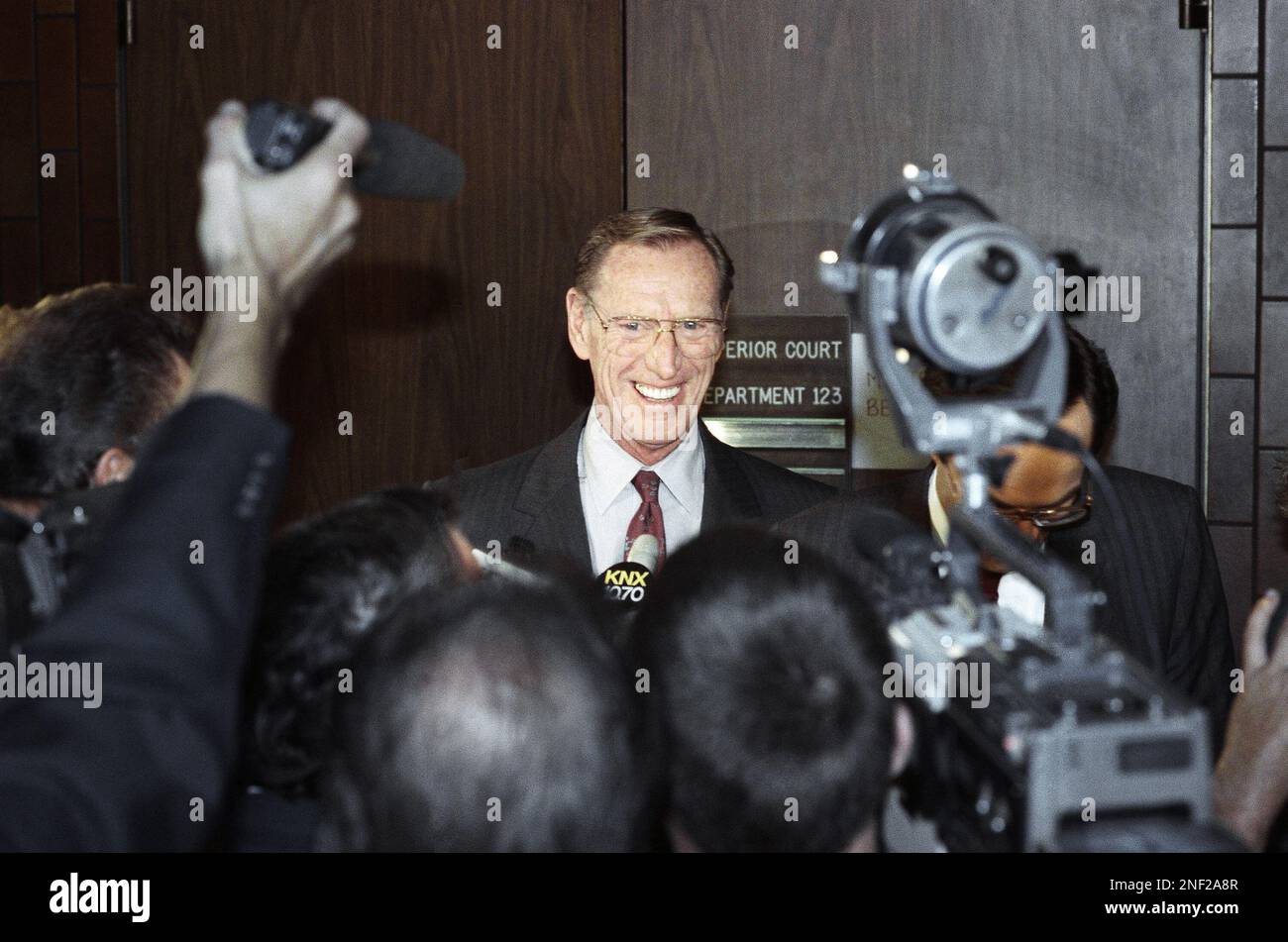 Charles Keating Jr. is all smiles as he leaves a Los Angeles courtroom ...