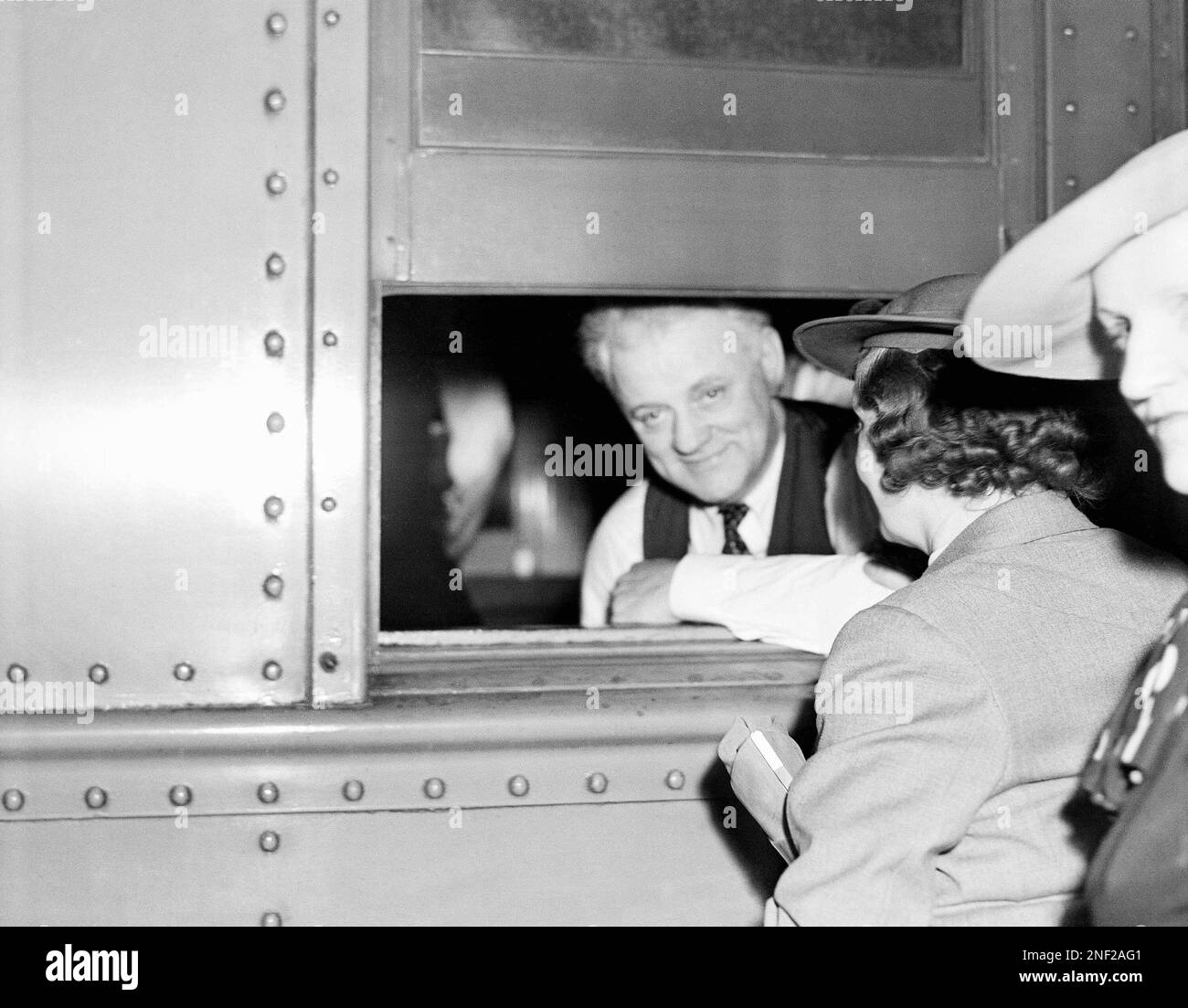 Louis Piquett, Chicago attorney, bids farewell to his wife as he left ...