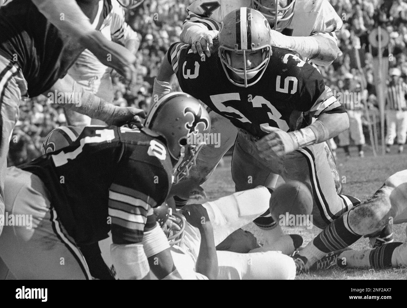 New Orleans Saints linebacker Dick Absher (53) eyes the football that ...