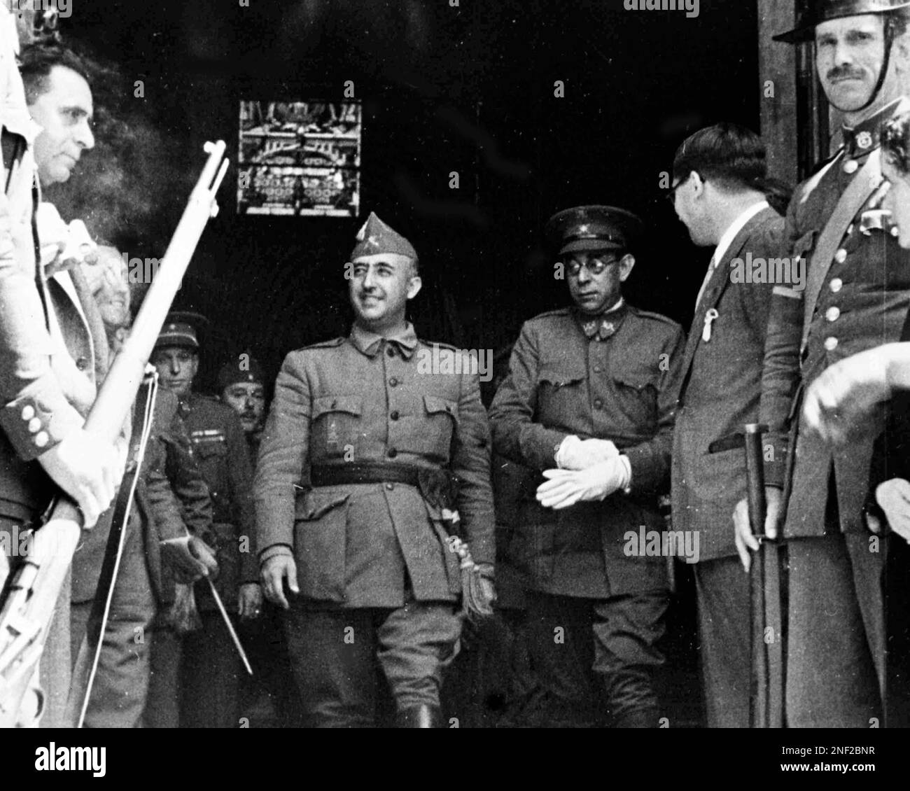 Spanish rebel Commander-in-Chief General Francisco Franco, left, leaves ...