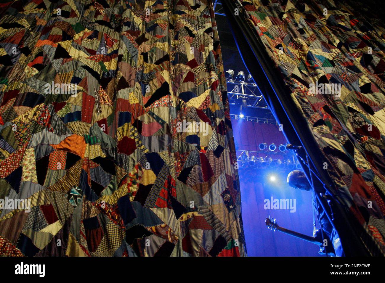 Dallas Cowboys player Marc Colombo pulls the stage curtain back before ...