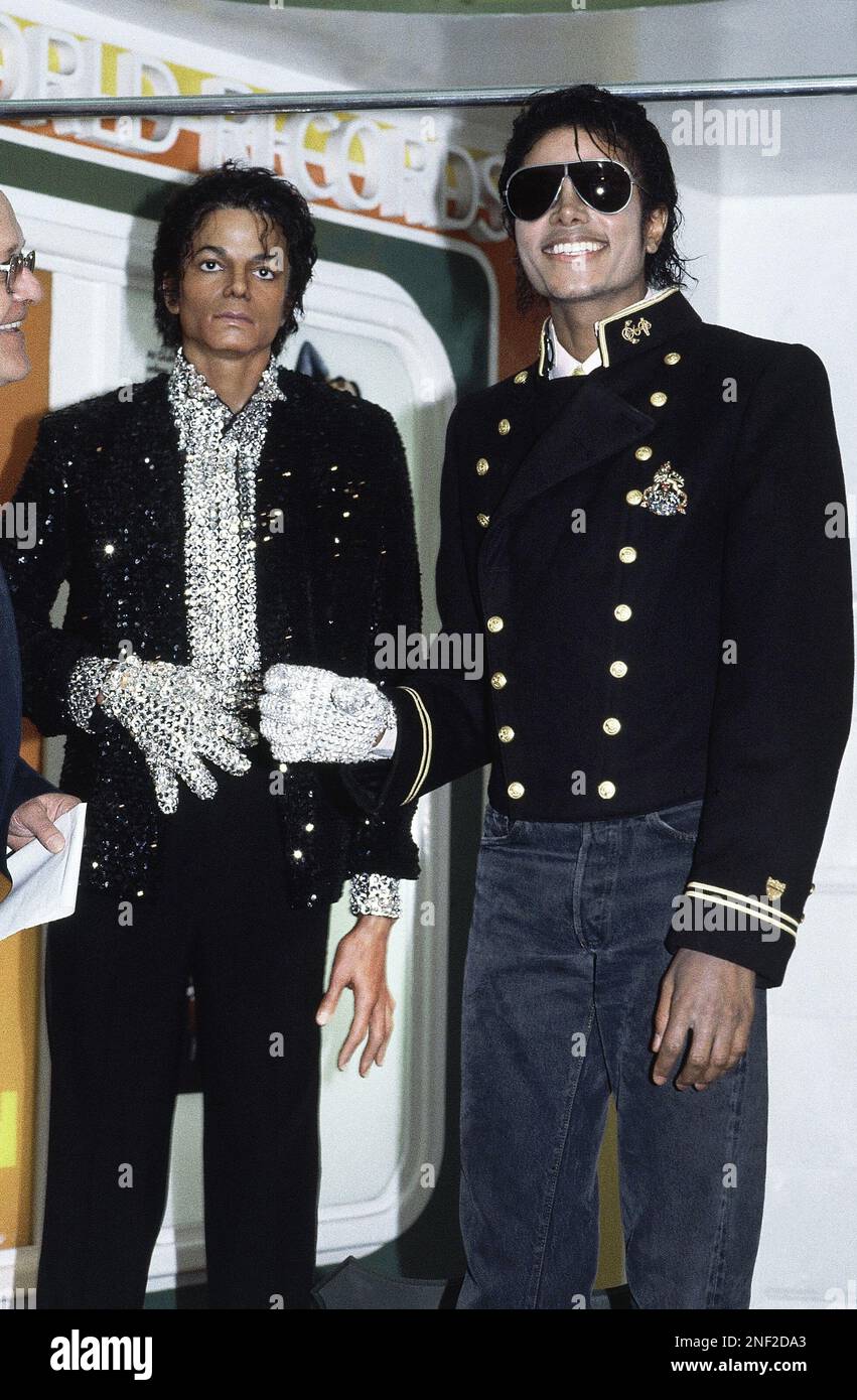 Superstar Michael Jackson unveils a life-size statue of himself at the ...