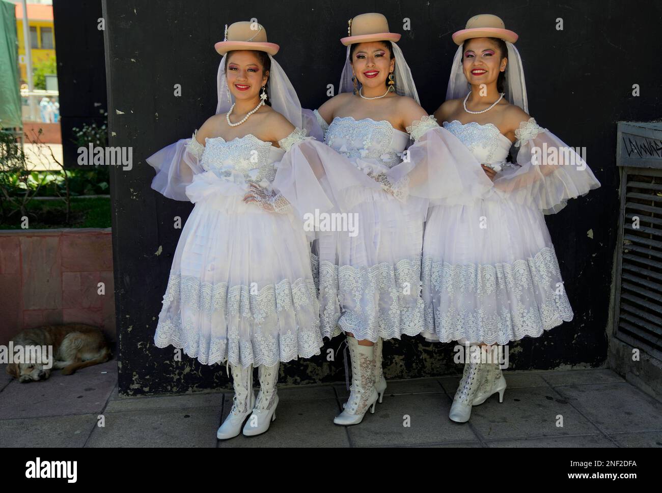 Women dressed as brides pose for a photo before the wedding of Pepino ...