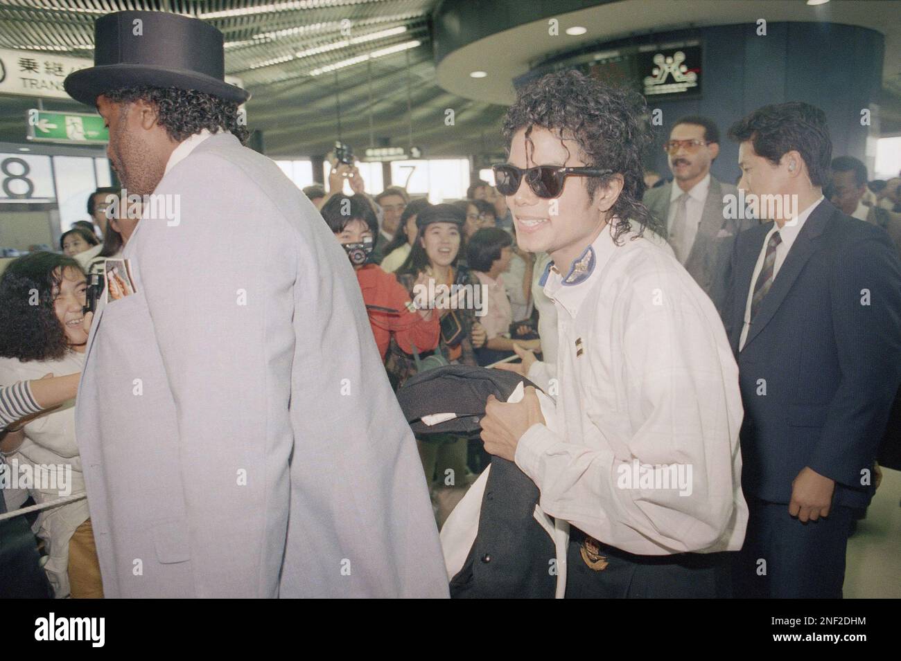 American superstar Michael Jackson smiles at a group of fans upon ...