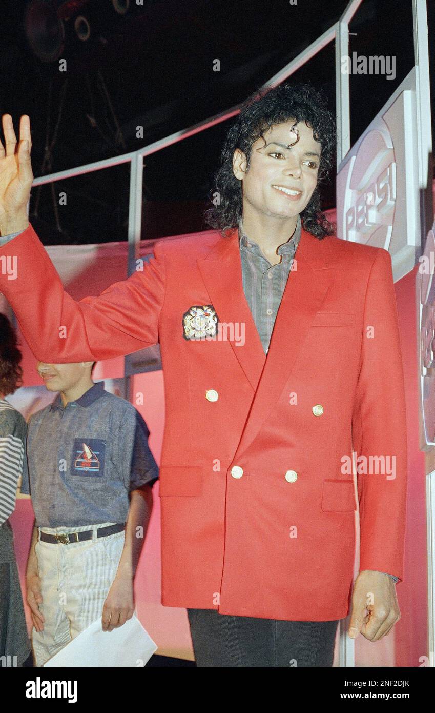 Michael Jackson gesture at a news conference on Tuesday, March 1, 1988 in New York. Jackson will ...