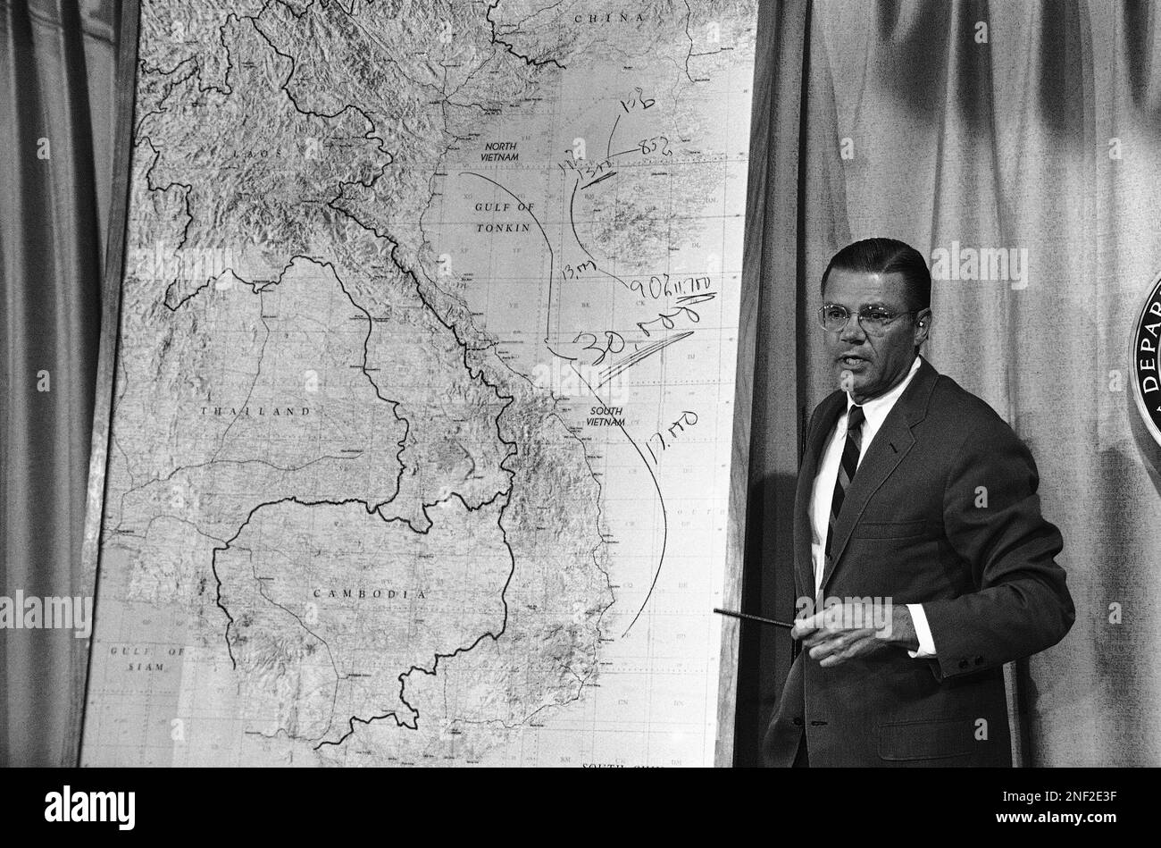 Defense Secretary Robert McNamara uses a map of Southeast Asia at a ...