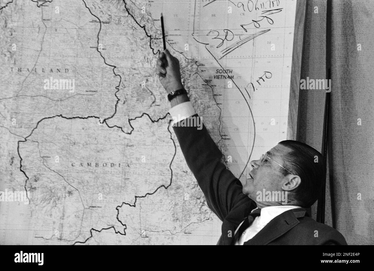 Defense Secretary Robert McNamara uses a map of Southeast Asia at a ...