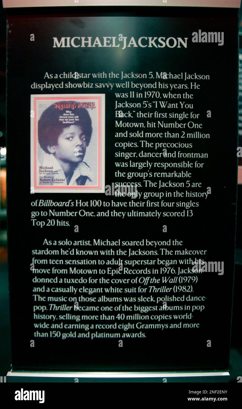 A plaque rests near an exhibit of Michael Jackson's artifacts at the ...
