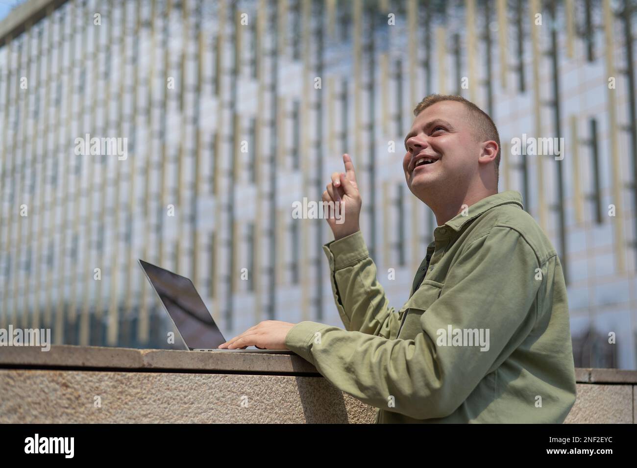 Caucasian man communicates in sign language via video link on laptop ...